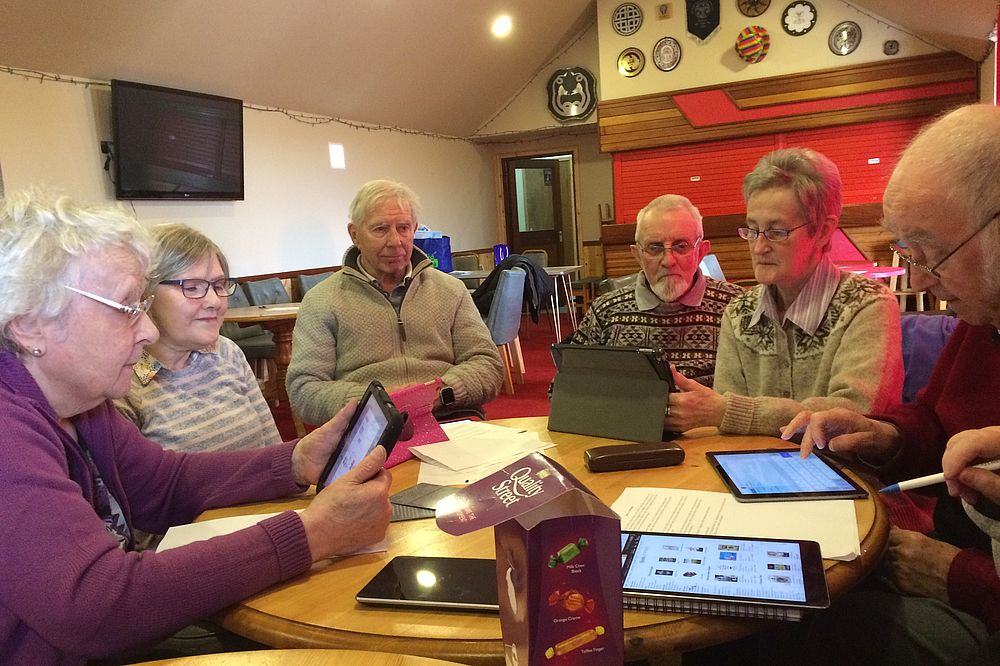 Pensioners using tablets
